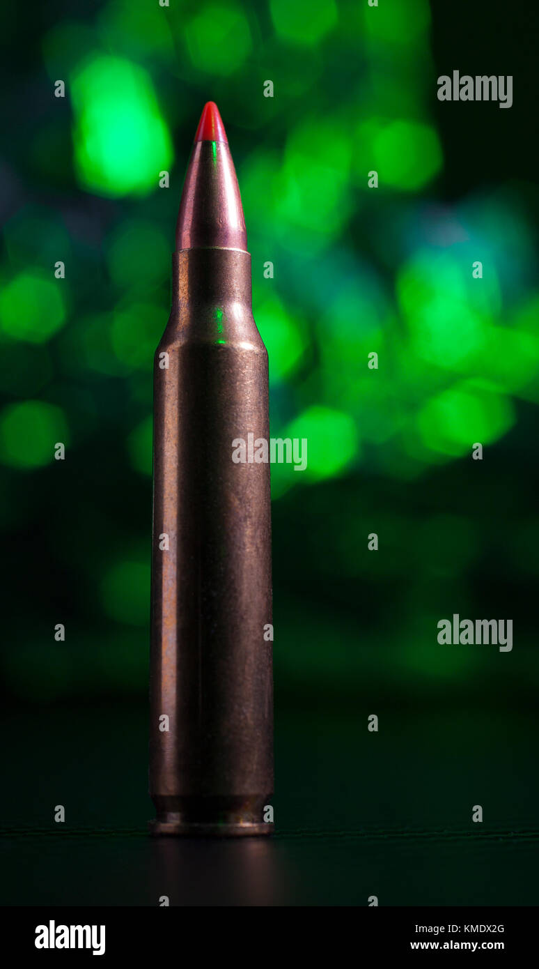 Ammunition used in an AR-15 with a green background Stock Photo - Alamy