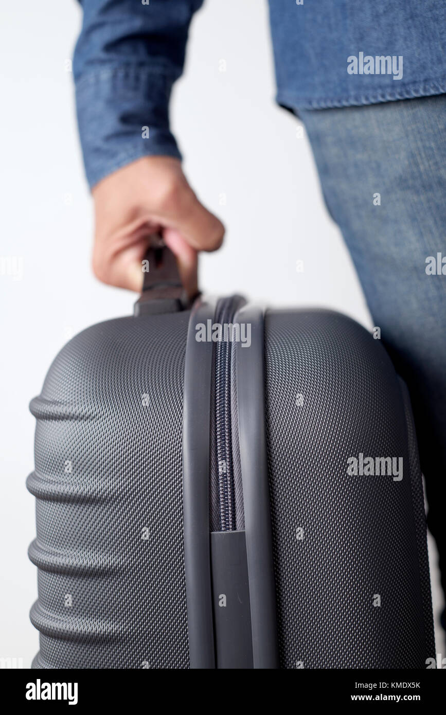 Man carrying a suitcase hi-res stock photography and images - Alamy