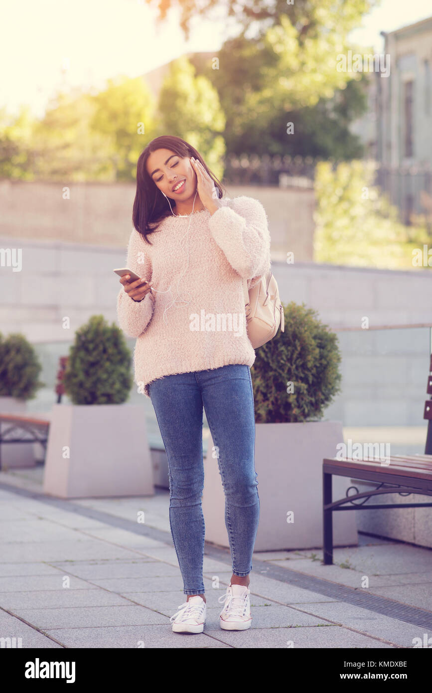 Positive young woman having a walk Stock Photo - Alamy
