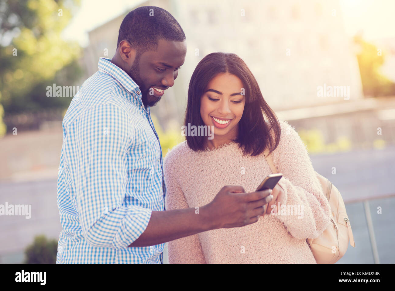Delighted positive man shoving a picture Stock Photo - Alamy