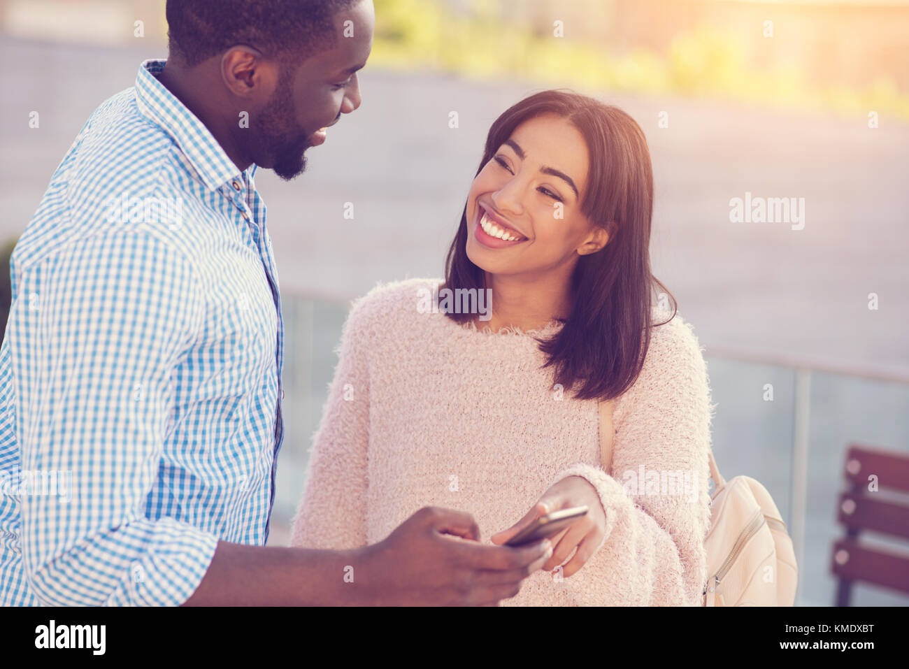 Happy delighted people looking at each other Stock Photo - Alamy