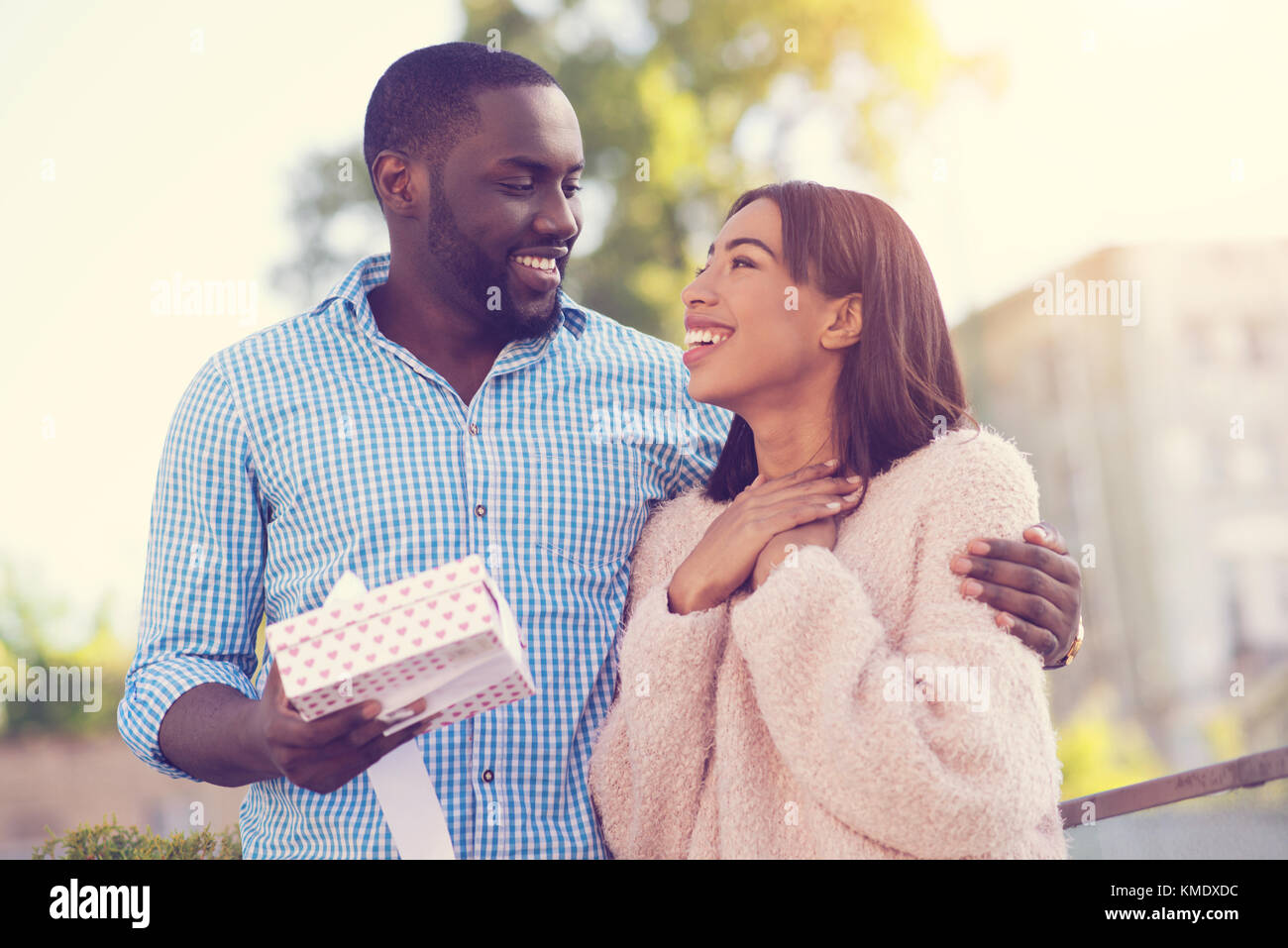 Happy delighted woman looking at her boyfriend Stock Photo - Alamy