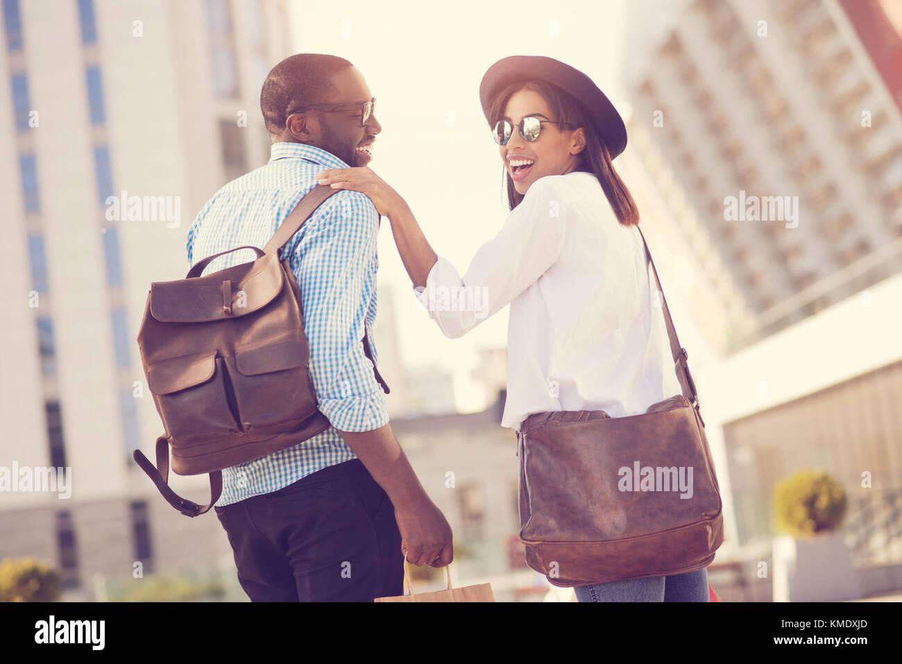 Cheerful nice couple having a walk Stock Photo - Alamy