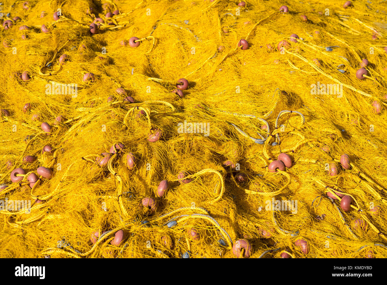 close up of a yellow fishnet with red floats Stock Photo - Alamy