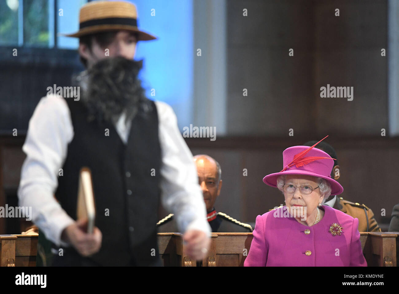 Queen Elizabeth II watches a performance by the Artless Theatre Company ...