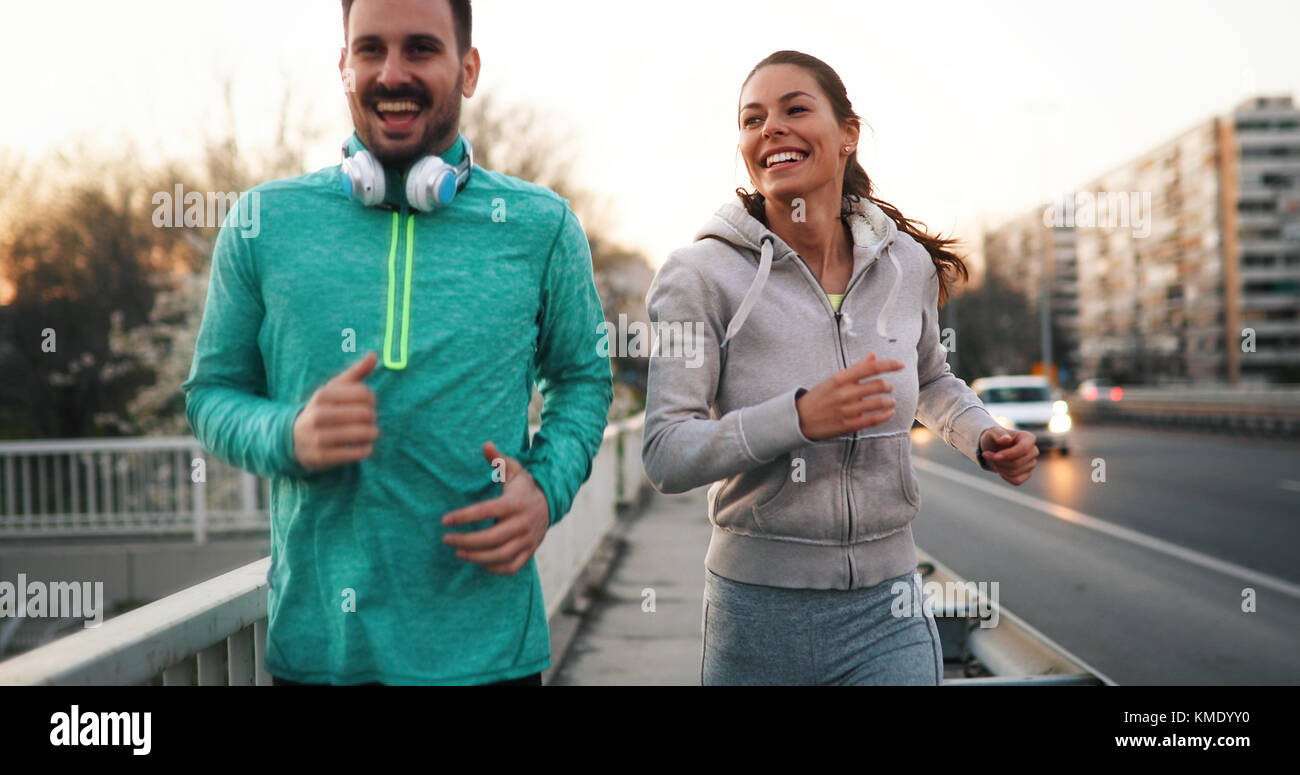Happy caucasian couple running on hi-res stock photography and images ...