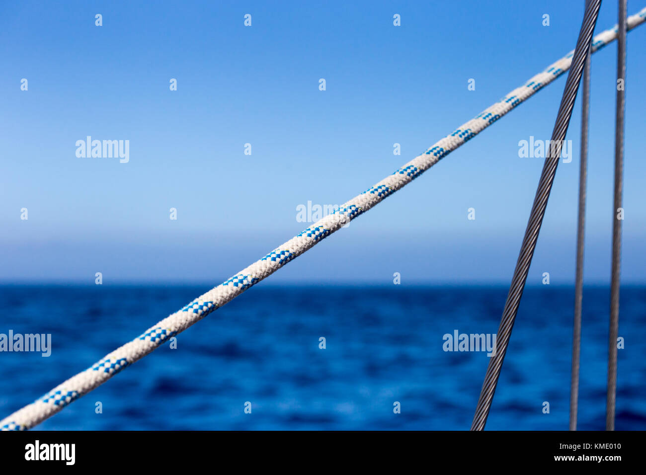 Sailing Ropes in Front of bight blue Ocean and Sky Background Stock ...