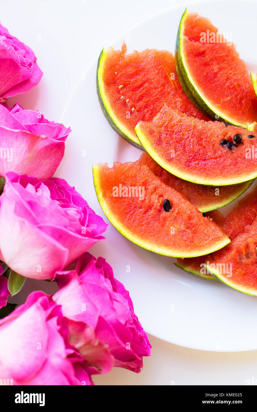 bouquet of pink roses on the table with watermelon Stock Photo - Alamy