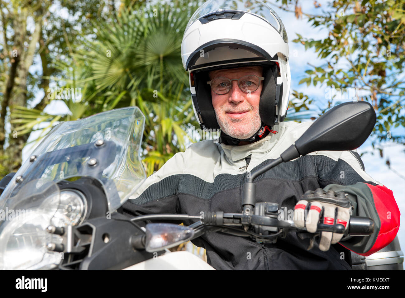 a portrait of a senior biker on his motorcycle Stock Photo - Alamy