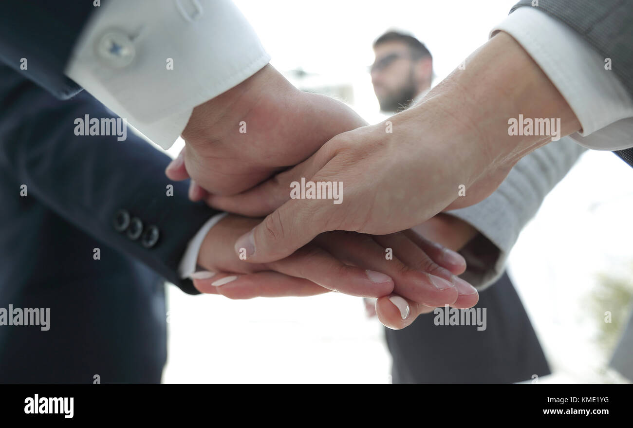 business people folding their hands together Stock Photo - Alamy
