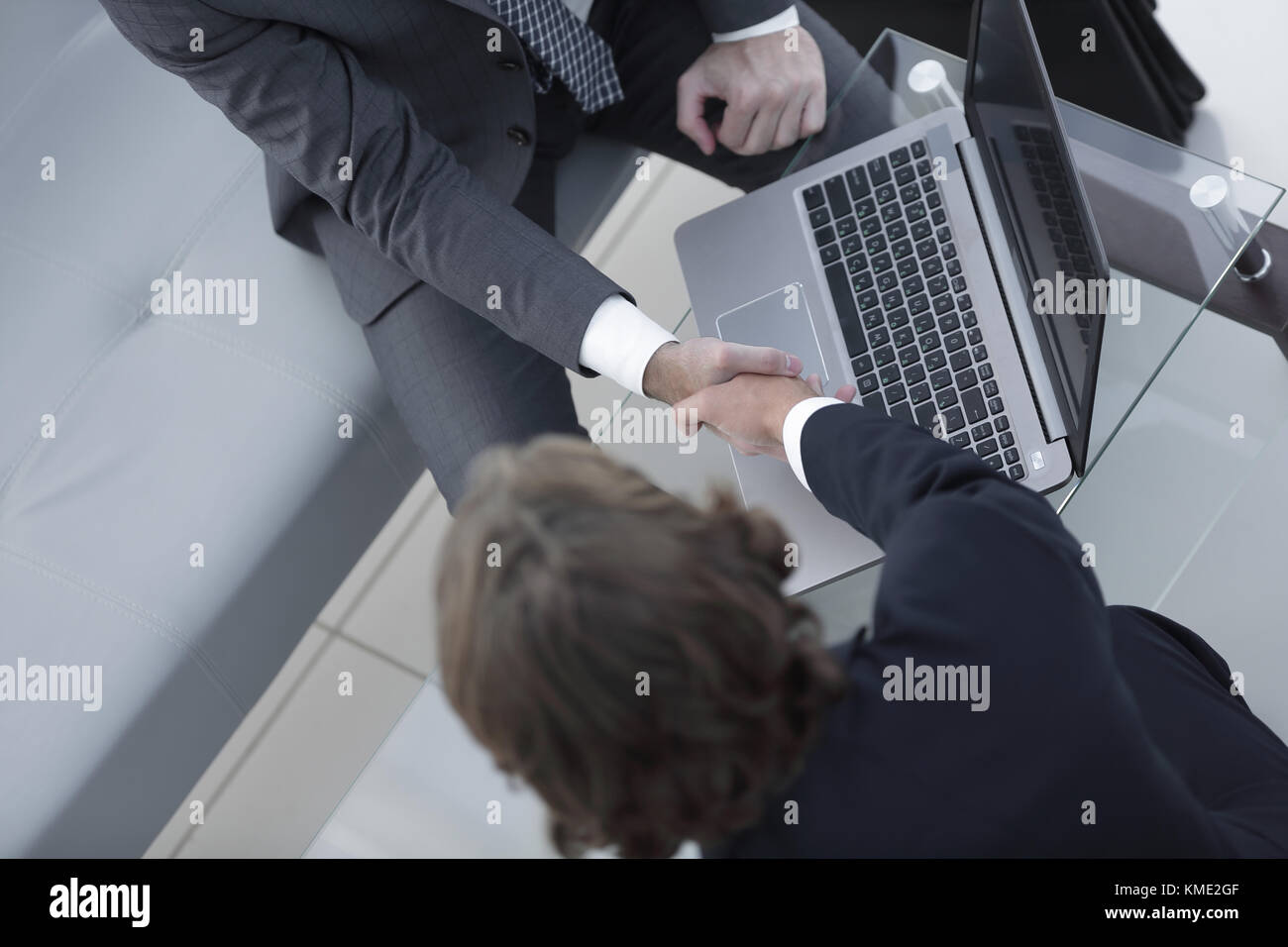 handshake of business partners above the Desk Stock Photo - Alamy