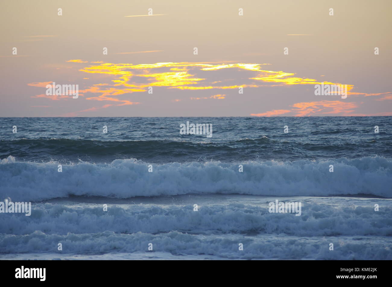 sunset ocean surf Stock Photo - Alamy
