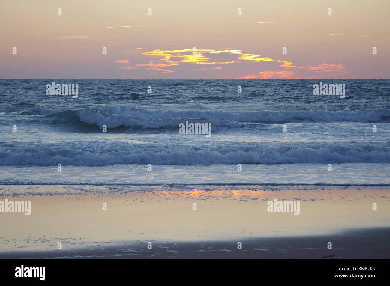 sunset ocean surf Stock Photo - Alamy