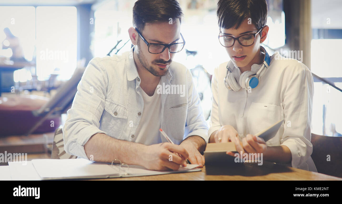 Young students studying in library Stock Photo - Alamy