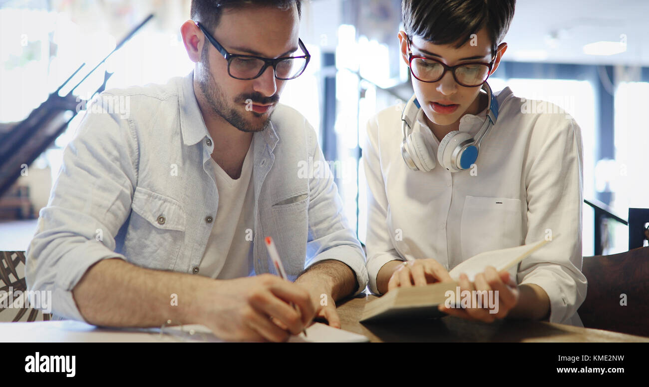 Young students studying in library Stock Photo - Alamy