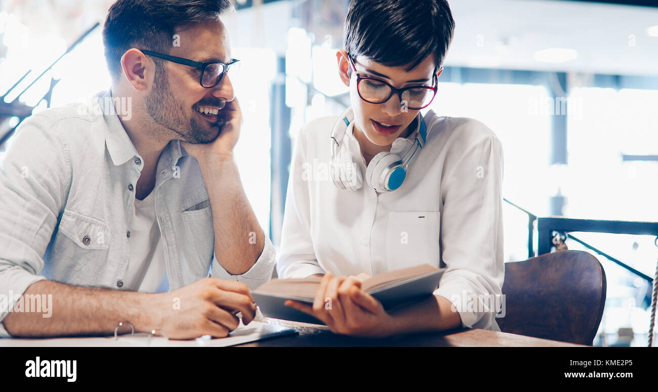 Young students studying in library Stock Photo - Alamy
