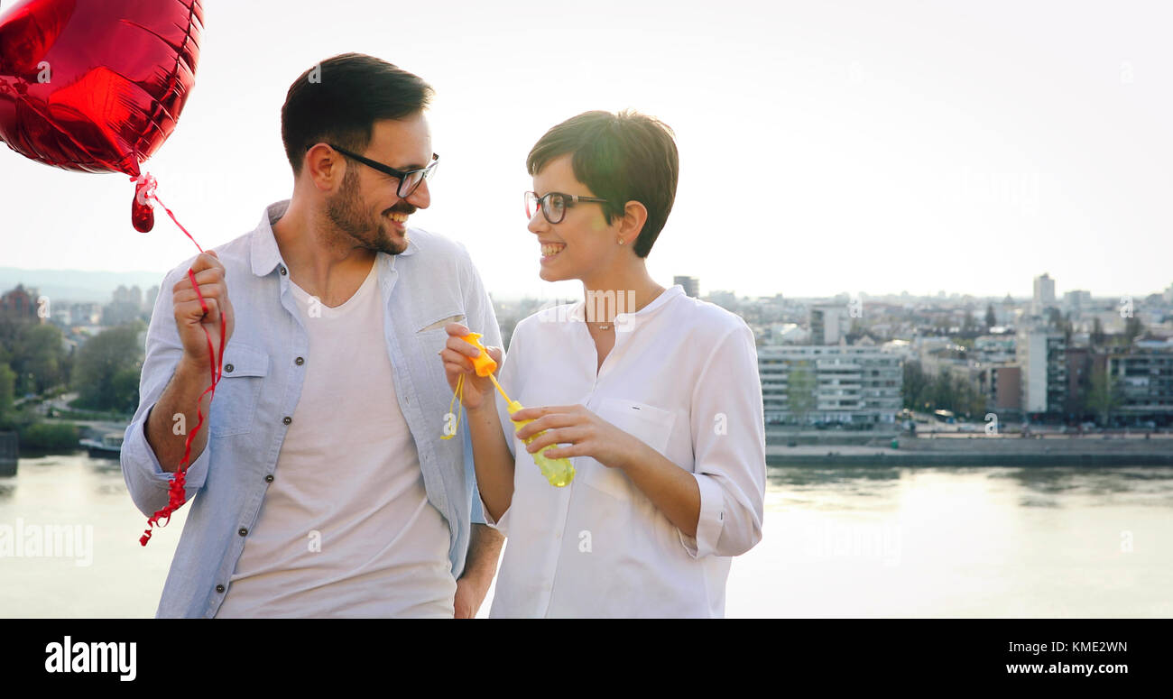 Beautiful couple in love at sunset hugging and dating Stock Photo - Alamy