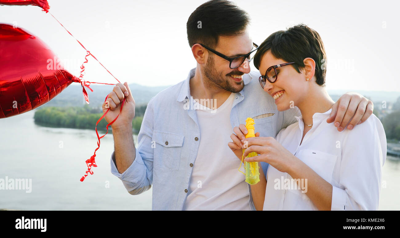 Beautiful couple in love at sunset hugging and dating Stock Photo - Alamy