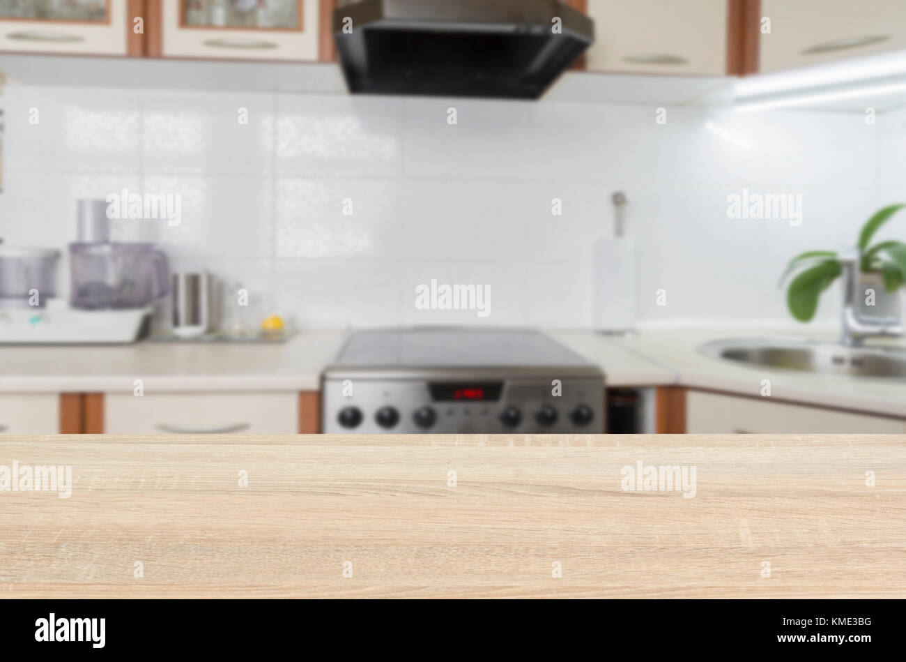 Wooden textured table over blurred kitchen interior background Stock ...