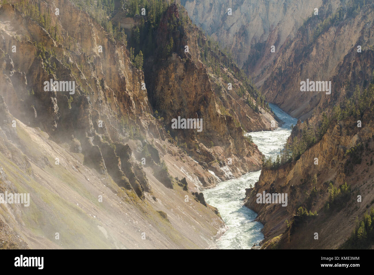 The Yellowstone River flows from the brink of the Lower Falls and ...