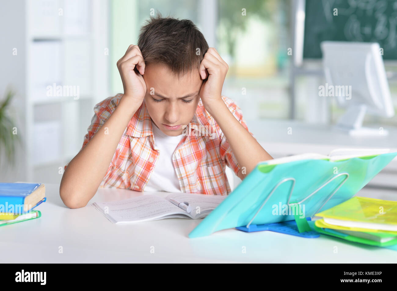 schoolboy doing homework Stock Photo - Alamy