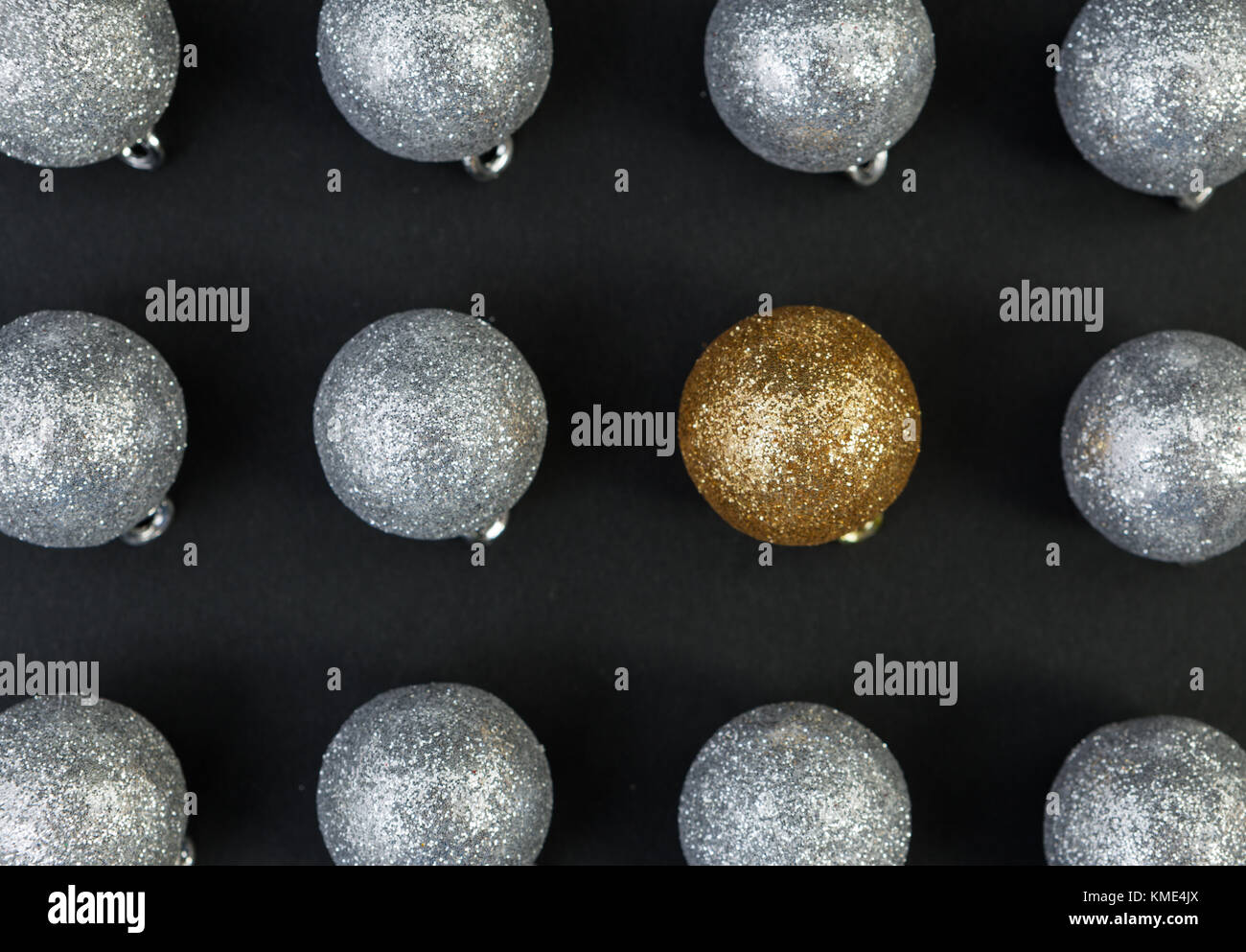 Golden ball in the middle of silver balls pattern as modern holiday ...