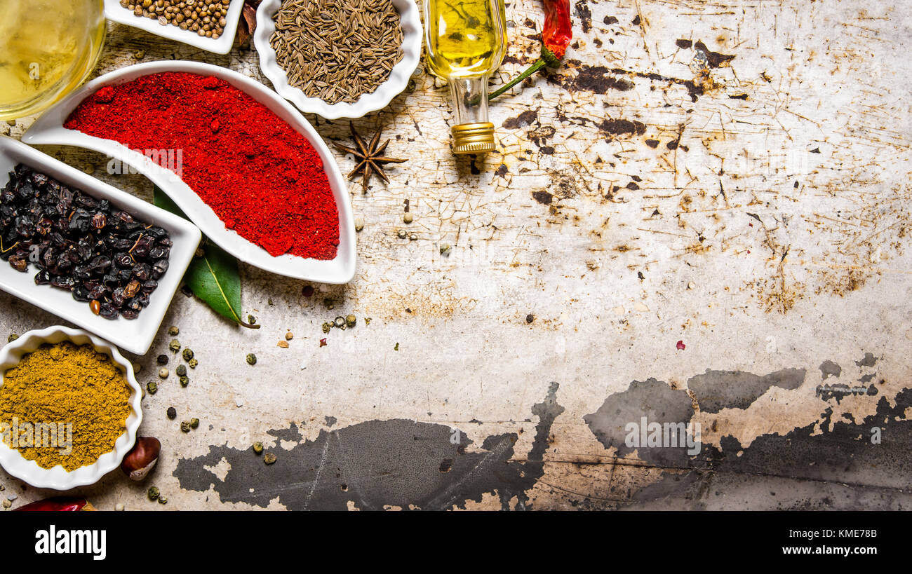 Set of colorful spices and herbs. On the rustic background. Free space ...
