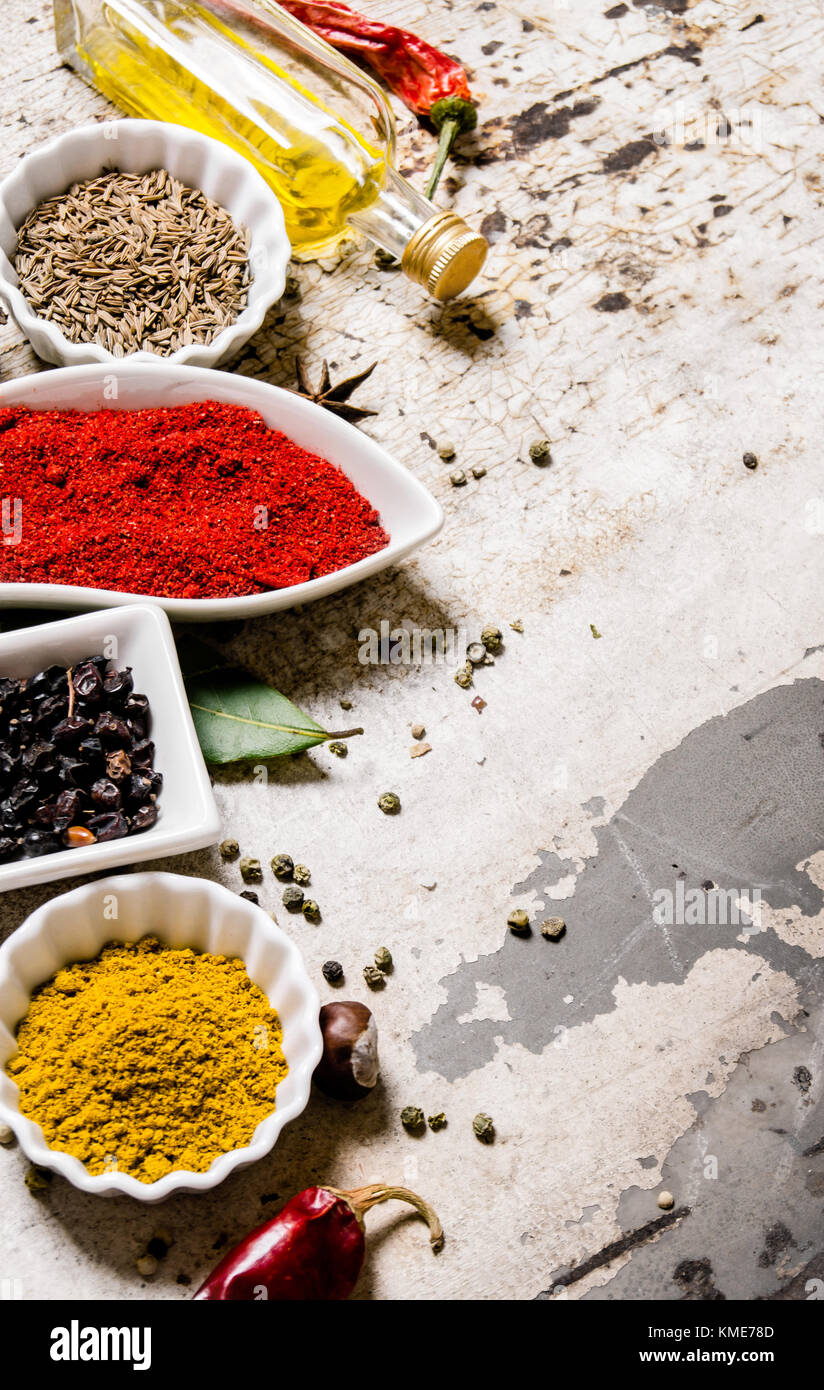 Set of colorful spices and herbs. On the rustic background. Free space ...