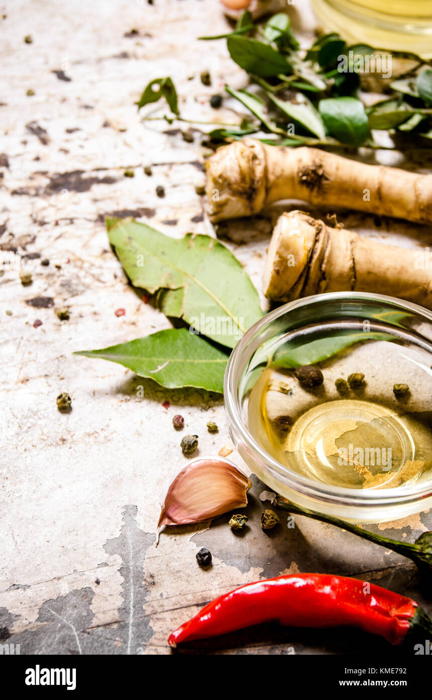 Spicy spices with olive oil. On the rustic background Stock Photo - Alamy