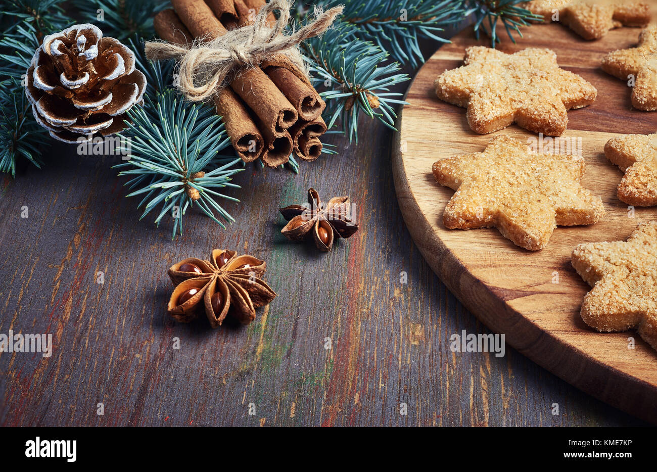 Christmas background with Christmas tree twigs, star-shaped cookies and ...