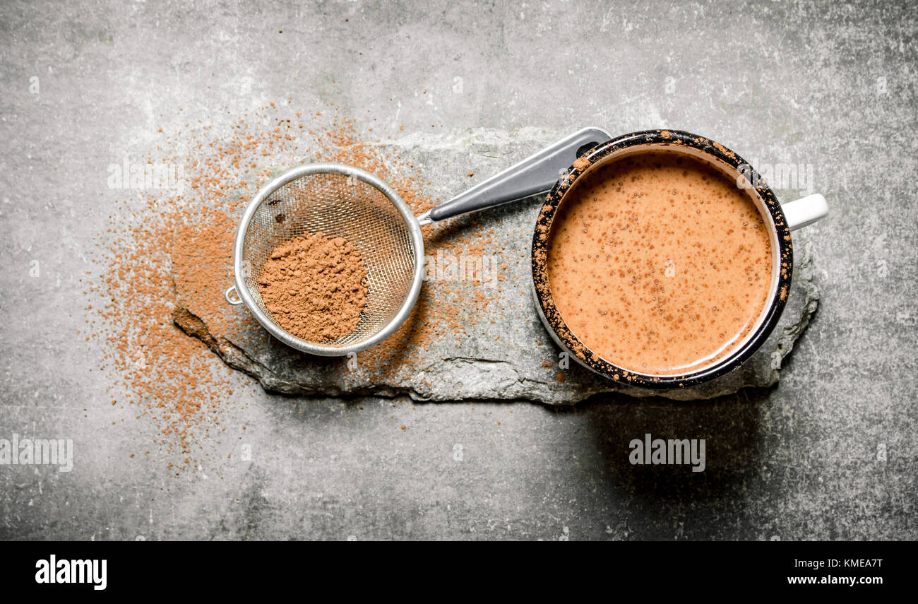 Cocoa beverage with ground cacao. On a stone background Stock Photo - Alamy