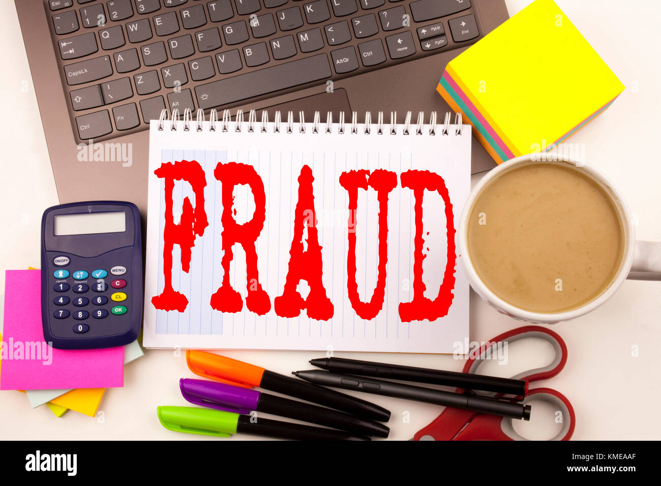 Writing word Fraud text in the office with surroundings such as marker ...