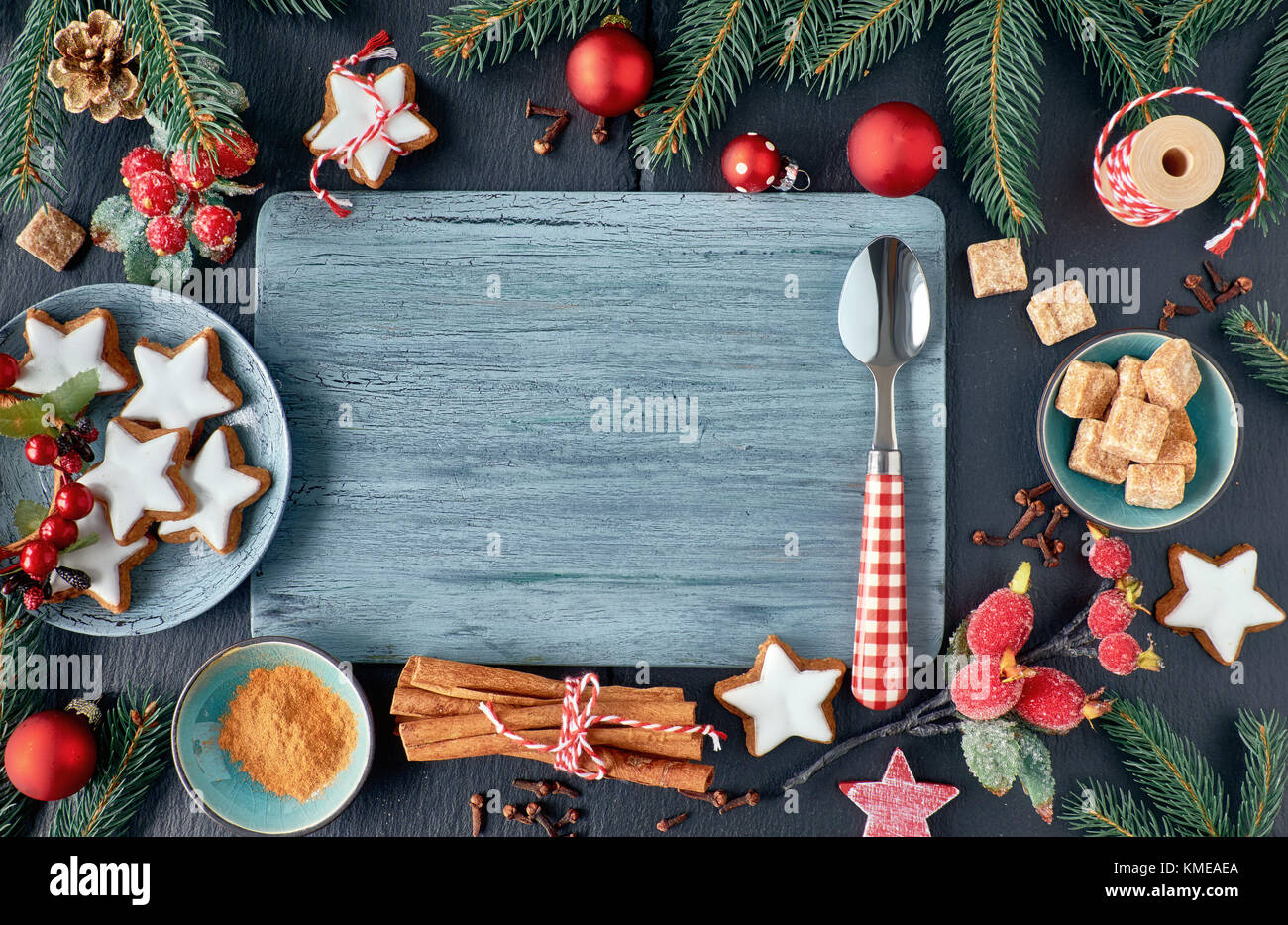 Seasonal background with decorated Christmas tree twigs on dark stone ...
