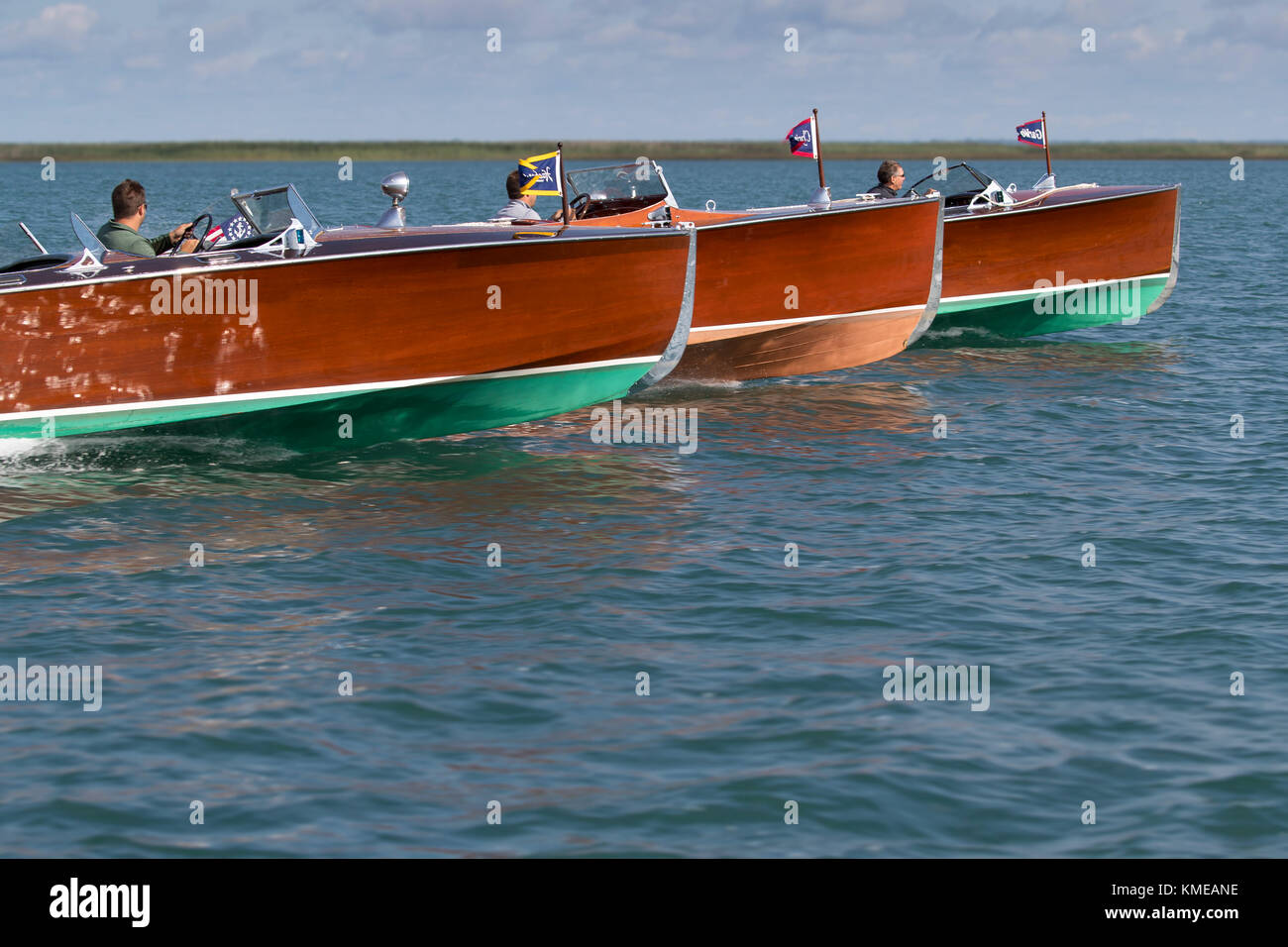 Three wood speedboats racing together in close formation Stock Photo ...