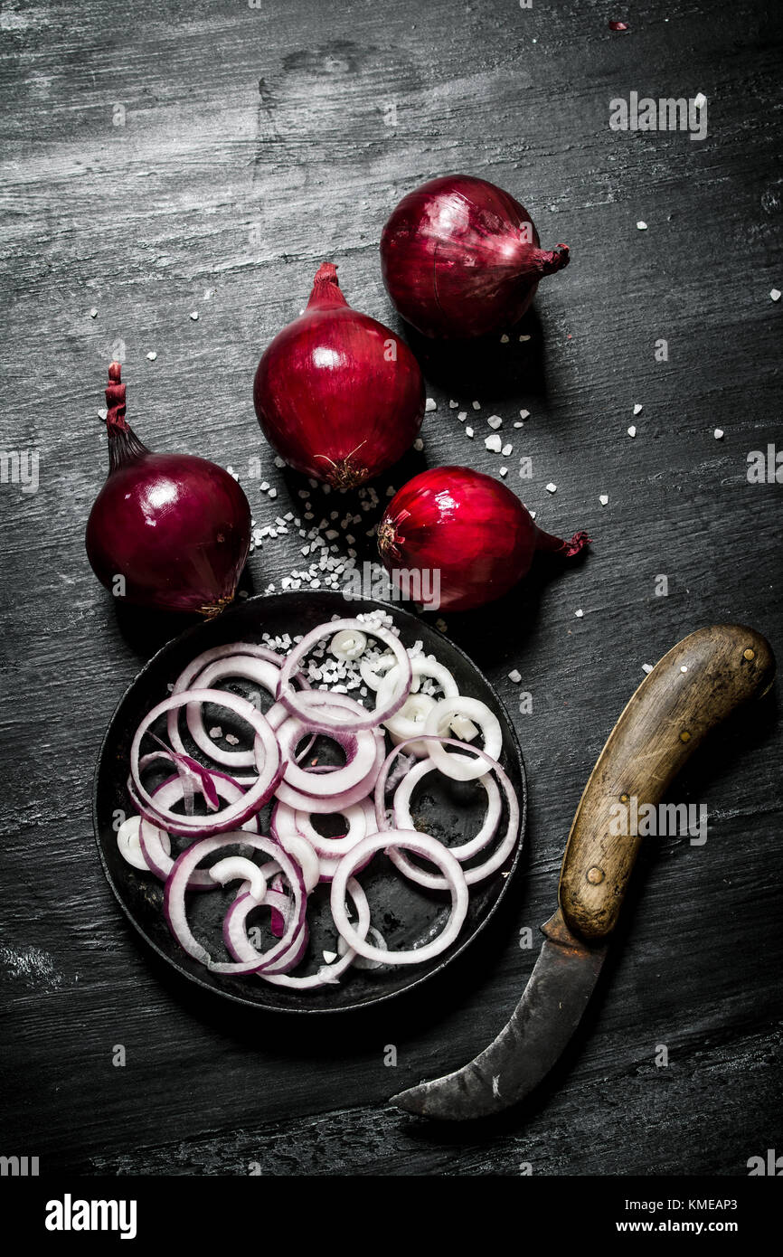 Fresh red onion cut into rings. On black rustic background Stock Photo ...