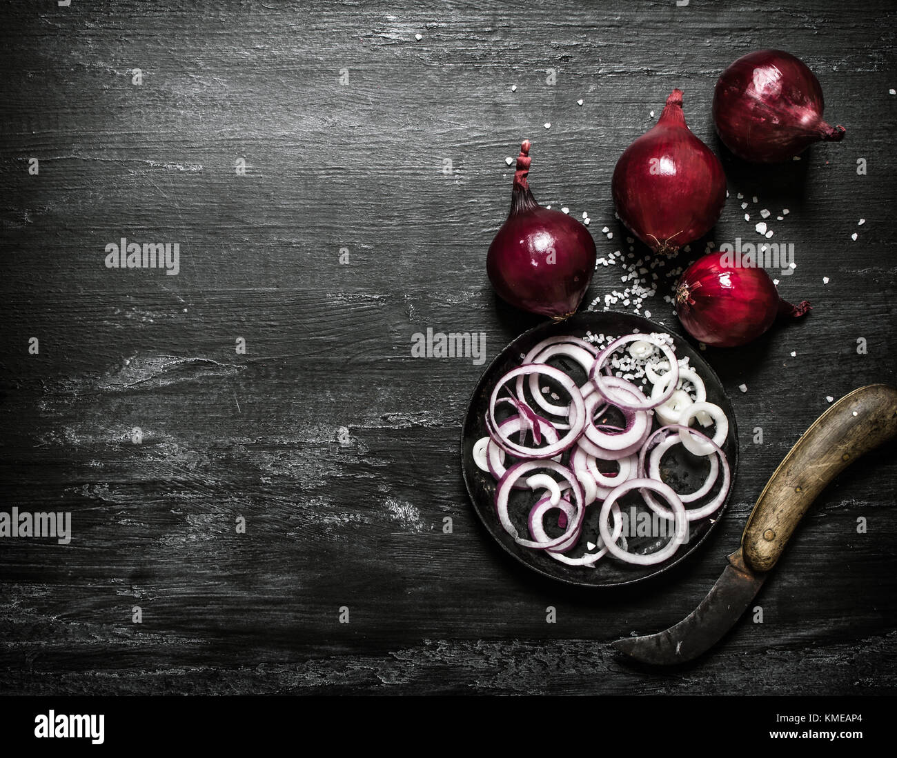 Fresh red onion cut into rings. On black rustic background Stock Photo ...