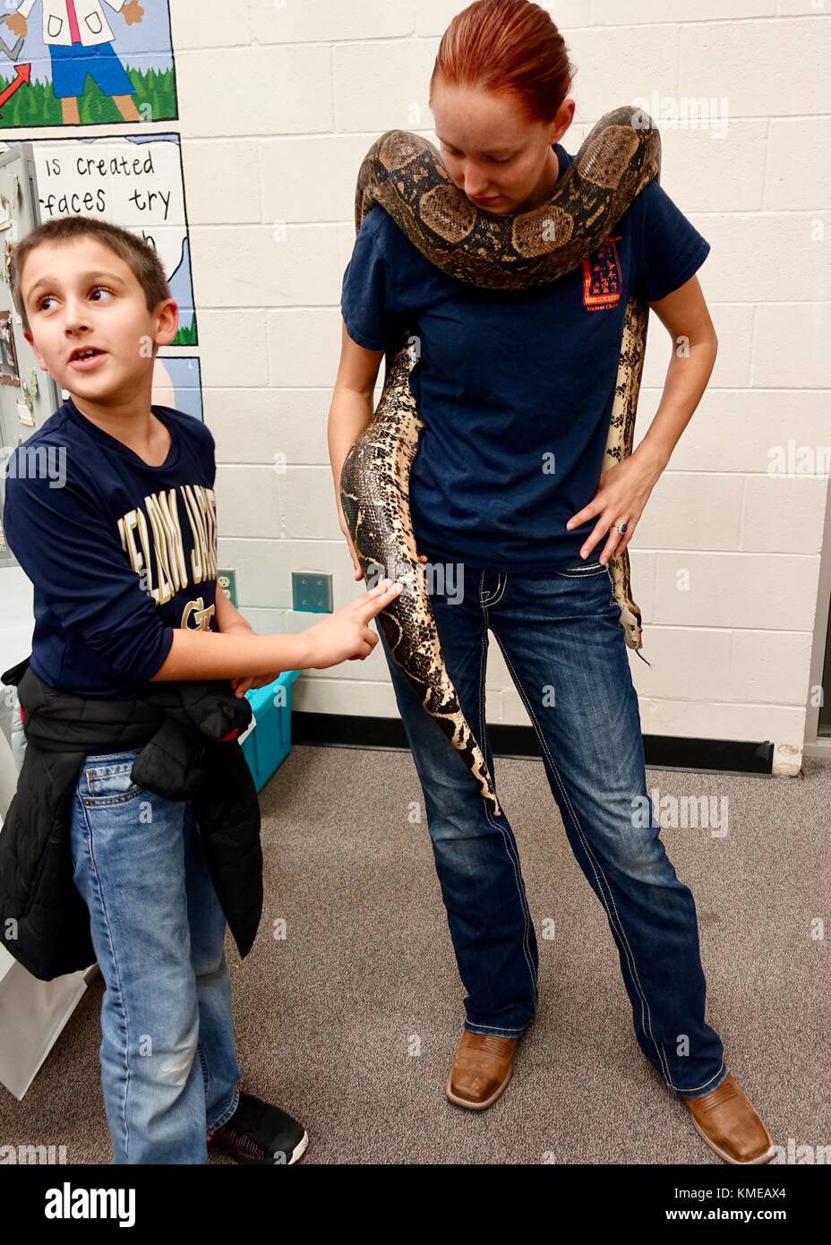 Student touching snake hi-res stock photography and images - Alamy