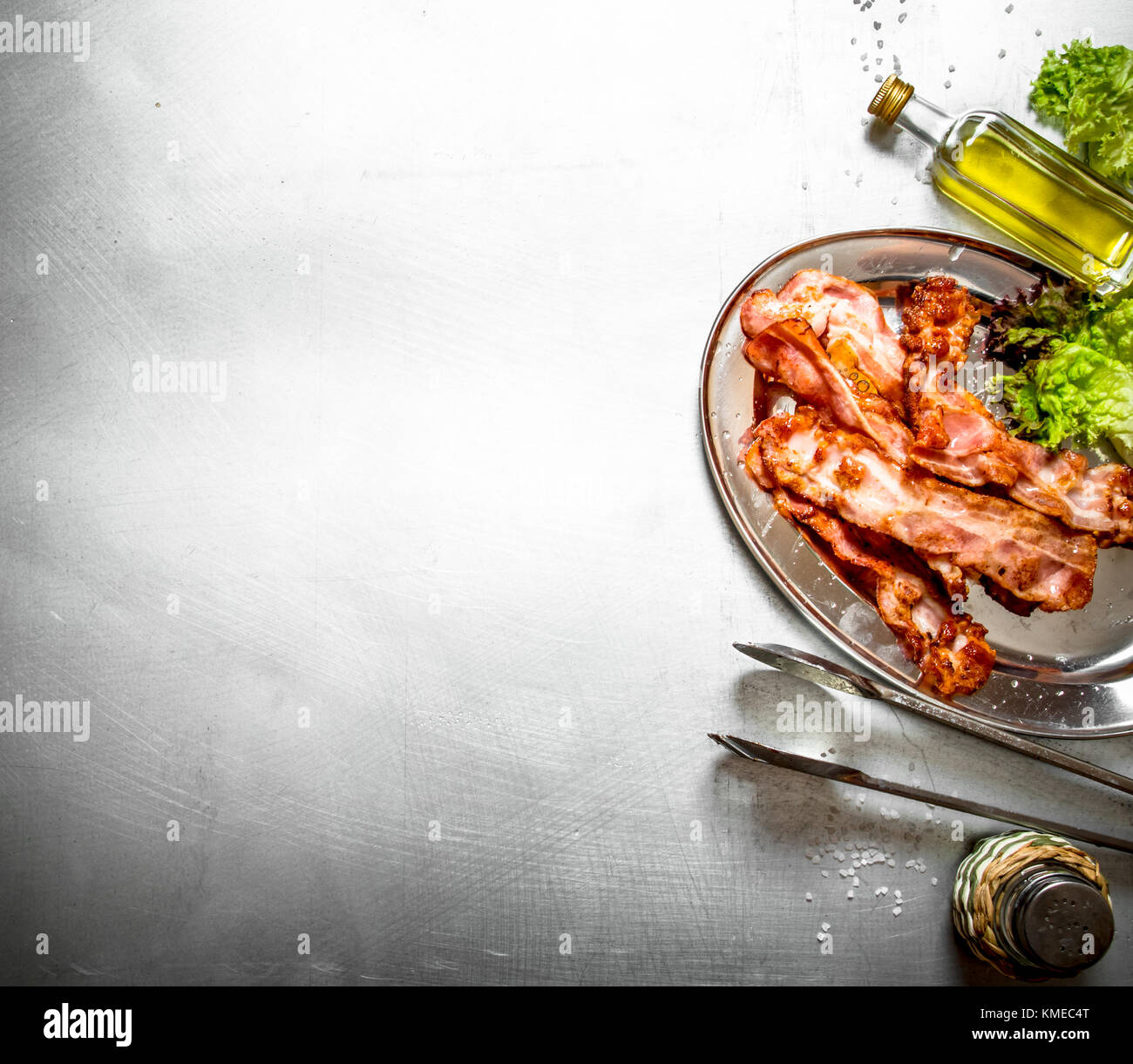 Fried bacon with herbs and salt . On the Metal table Stock Photo - Alamy