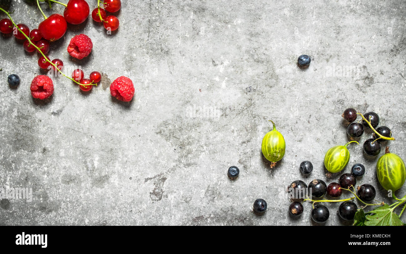 Fresh berries. On an old stone table Stock Photo - Alamy