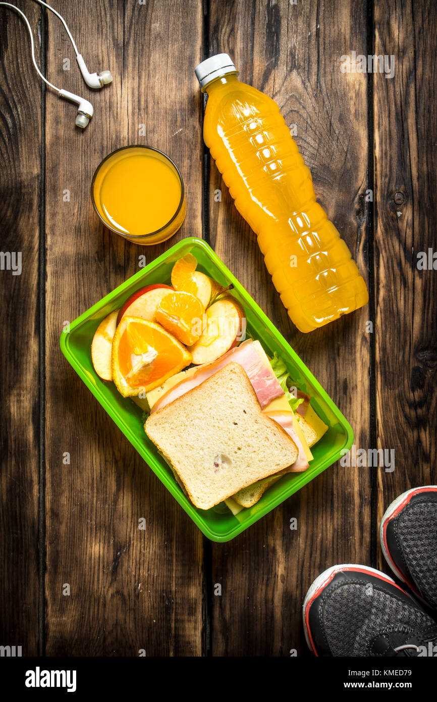 Sports Breakfast. Sneakers, headphones and orange juice Stock Photo - Alamy
