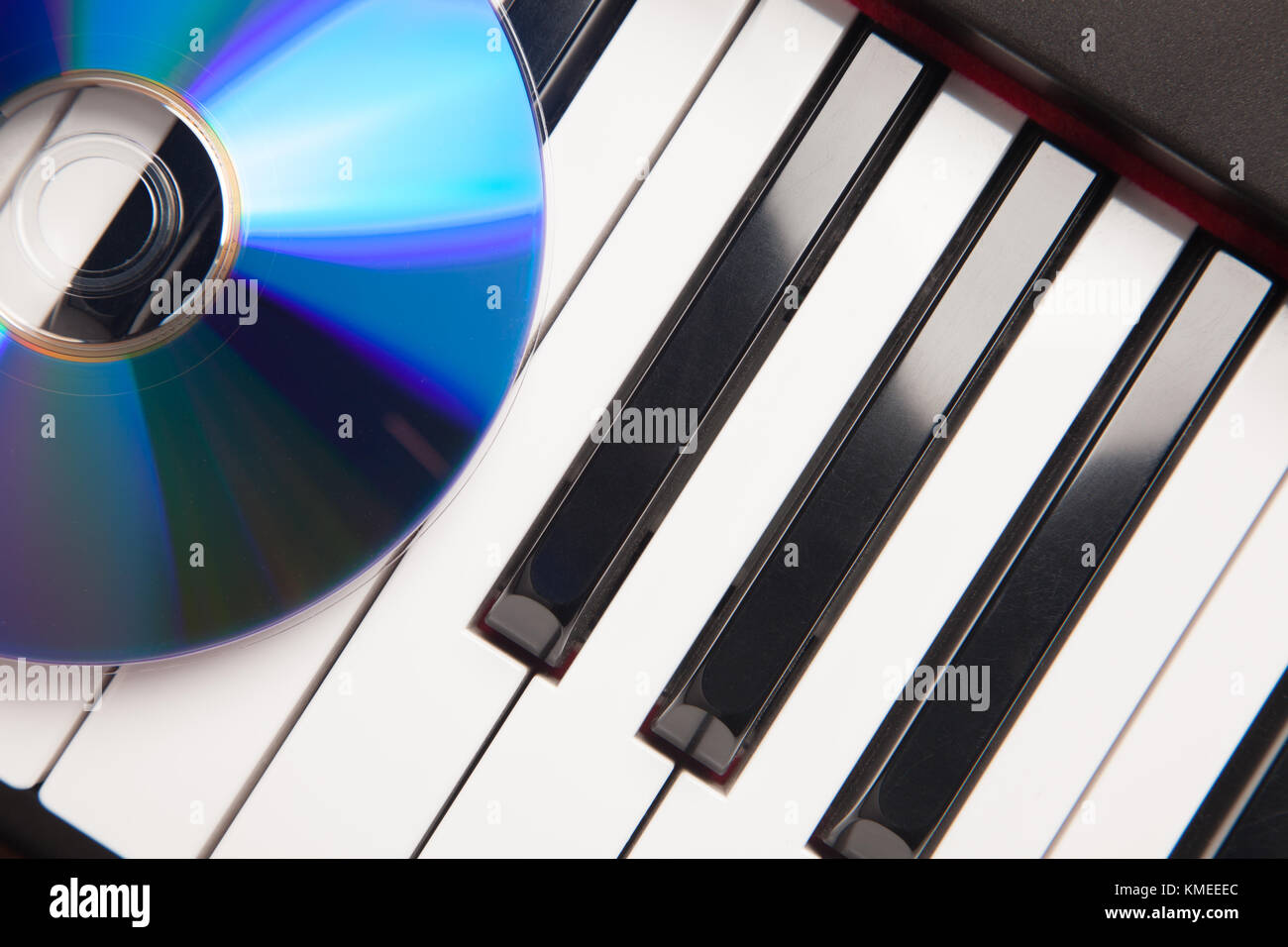 CD Laying on Piano Keyboards Abstract Stock Photo - Alamy
