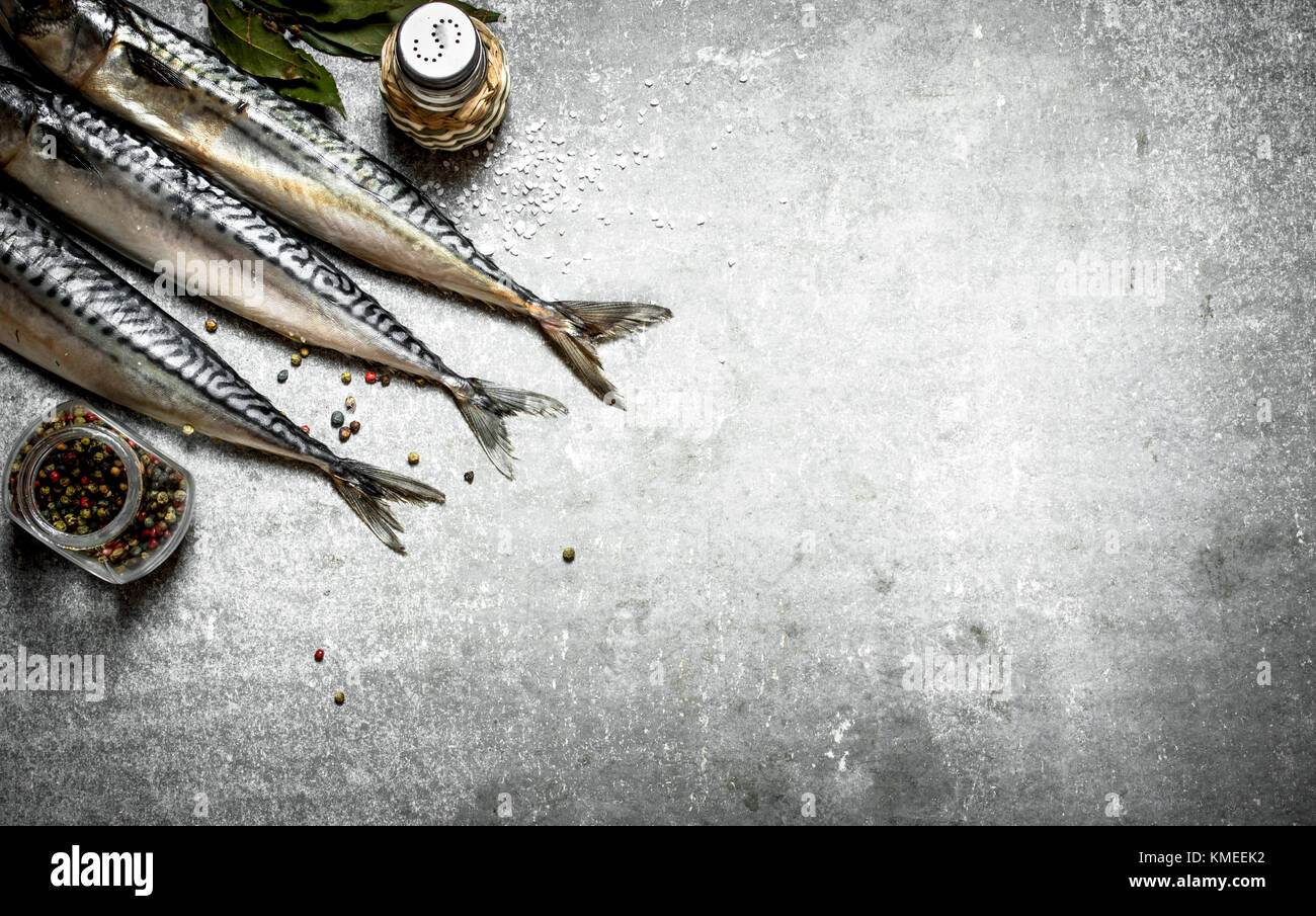 Fish with peppercorn and salt. On the stone table Stock Photo - Alamy