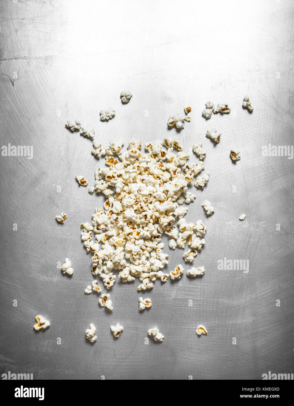 Popcorn on metal. On the metal table Stock Photo - Alamy