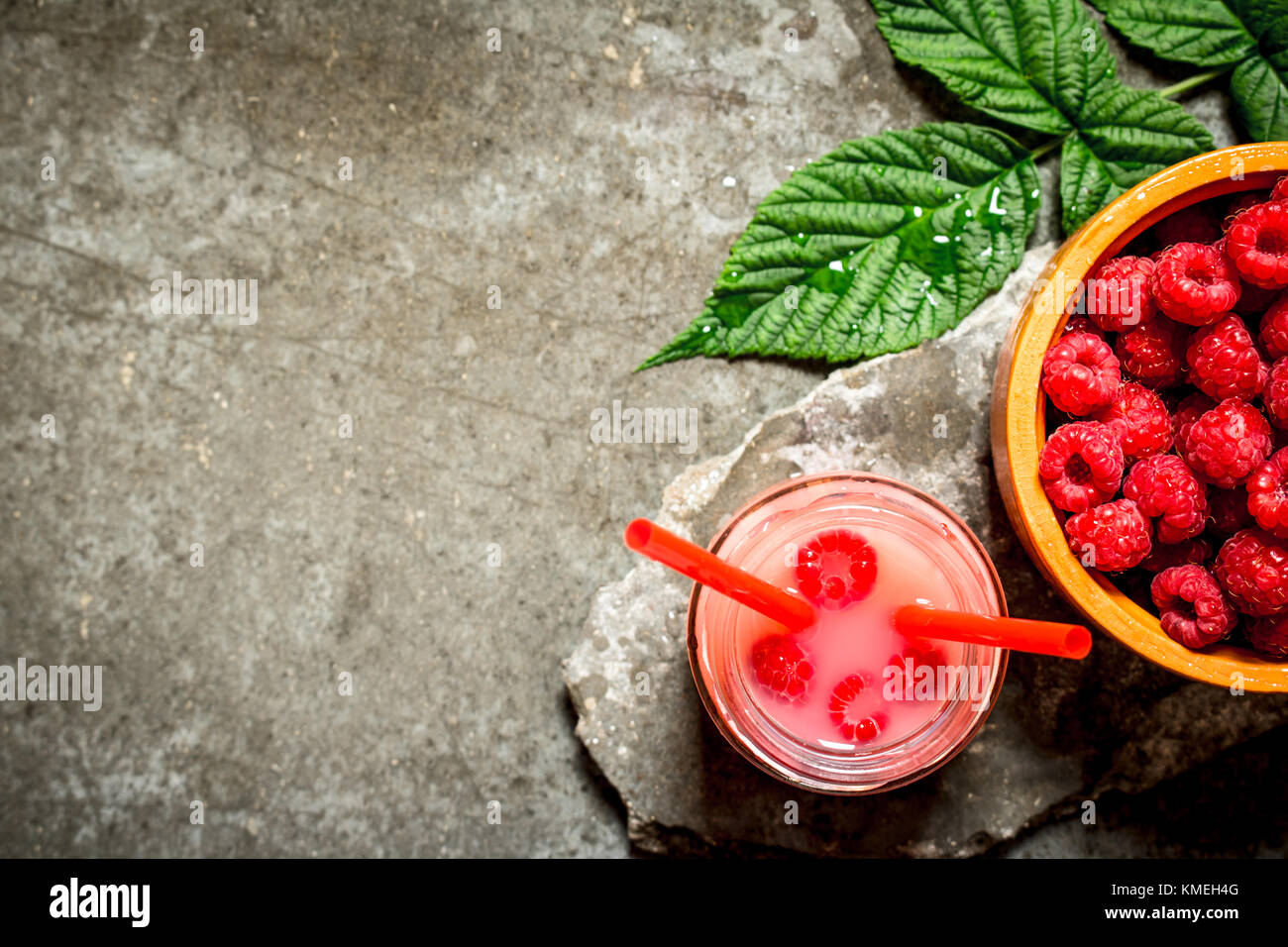 Fresh raspberry juice. On the stone table Stock Photo - Alamy