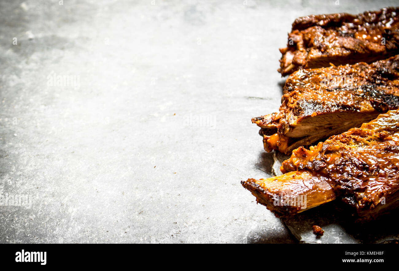 Pork ribs grill. On a stone background Stock Photo - Alamy