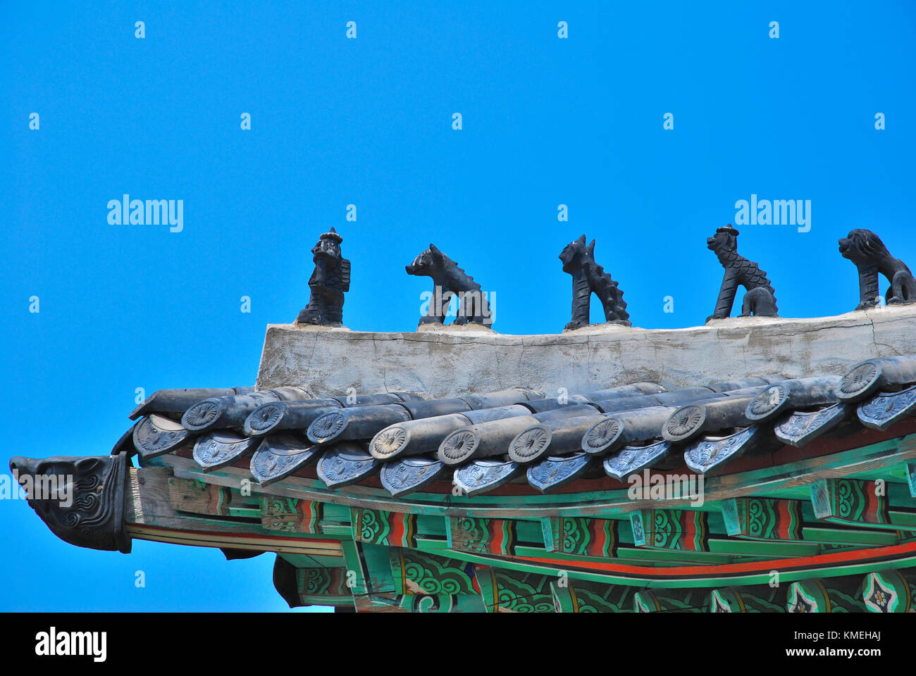 Unique animal statues on temple roof with blue sky background Stock ...
