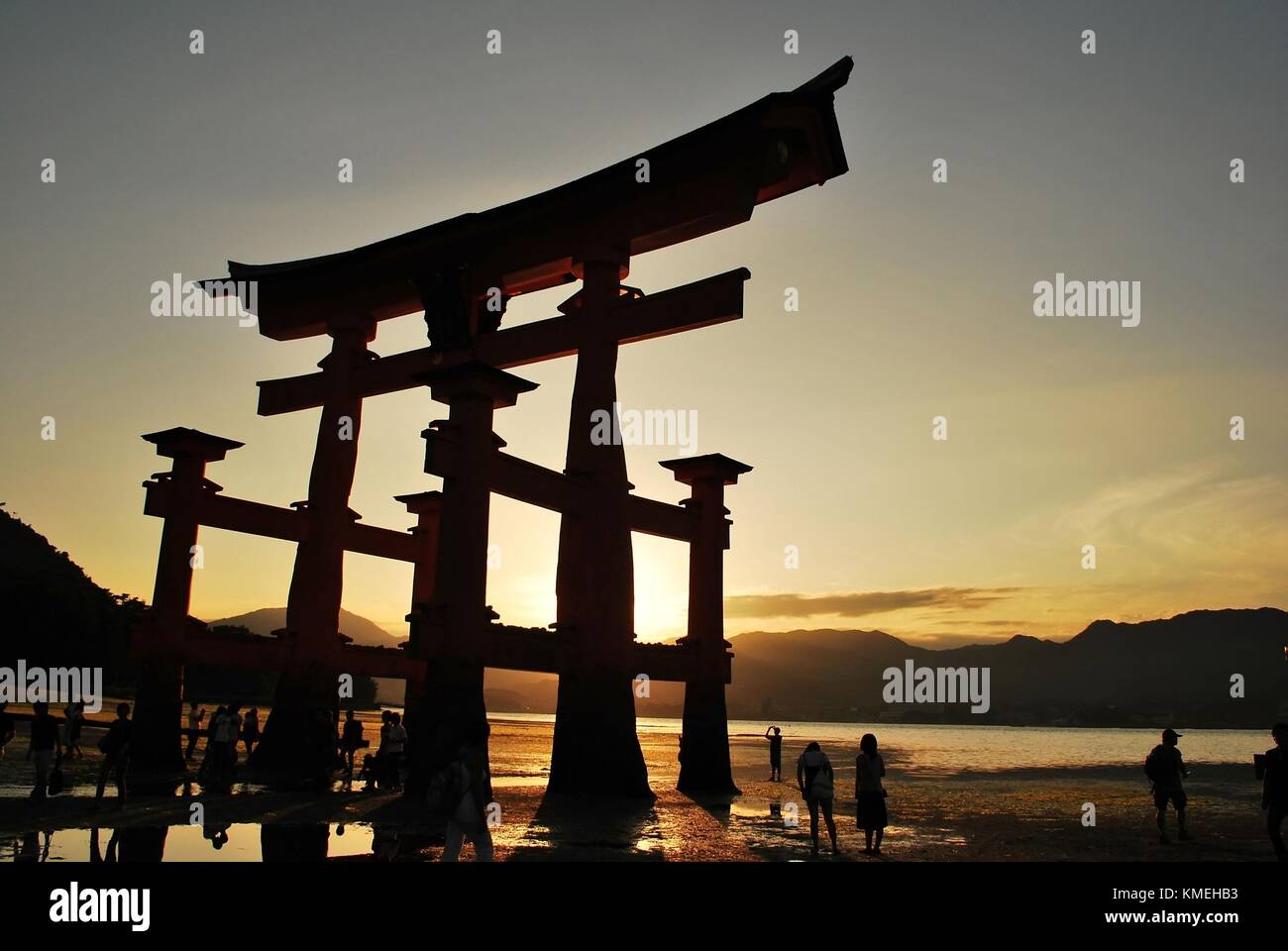 Famous torii gate of Itsukushima Shrine during sunset taken on ...