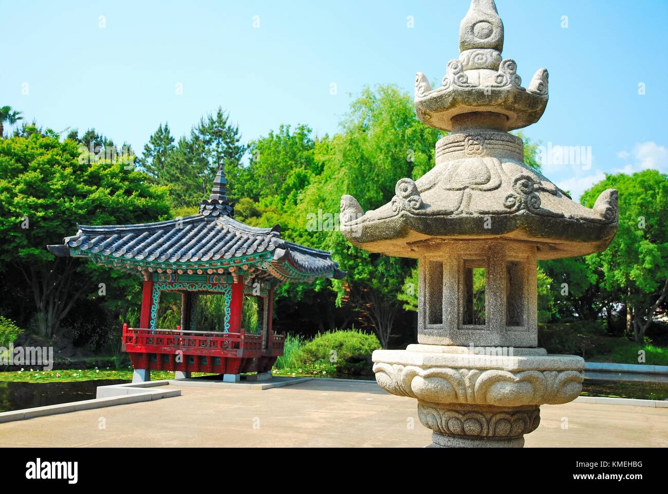 Stone lamp with quaint, Asian-styled pavillion architecture in ...