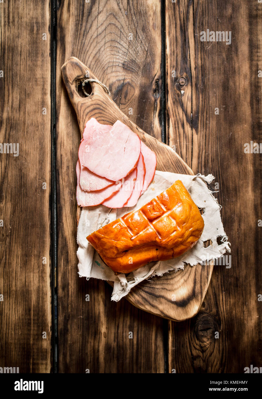 Sliced ham on the Board. On wooden background Stock Photo - Alamy