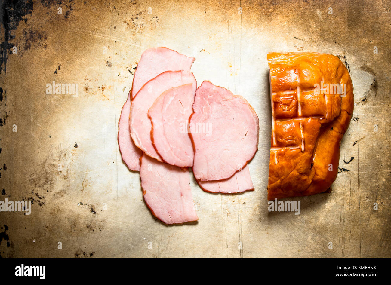 Thin slices of ham. On an old rustic background Stock Photo - Alamy